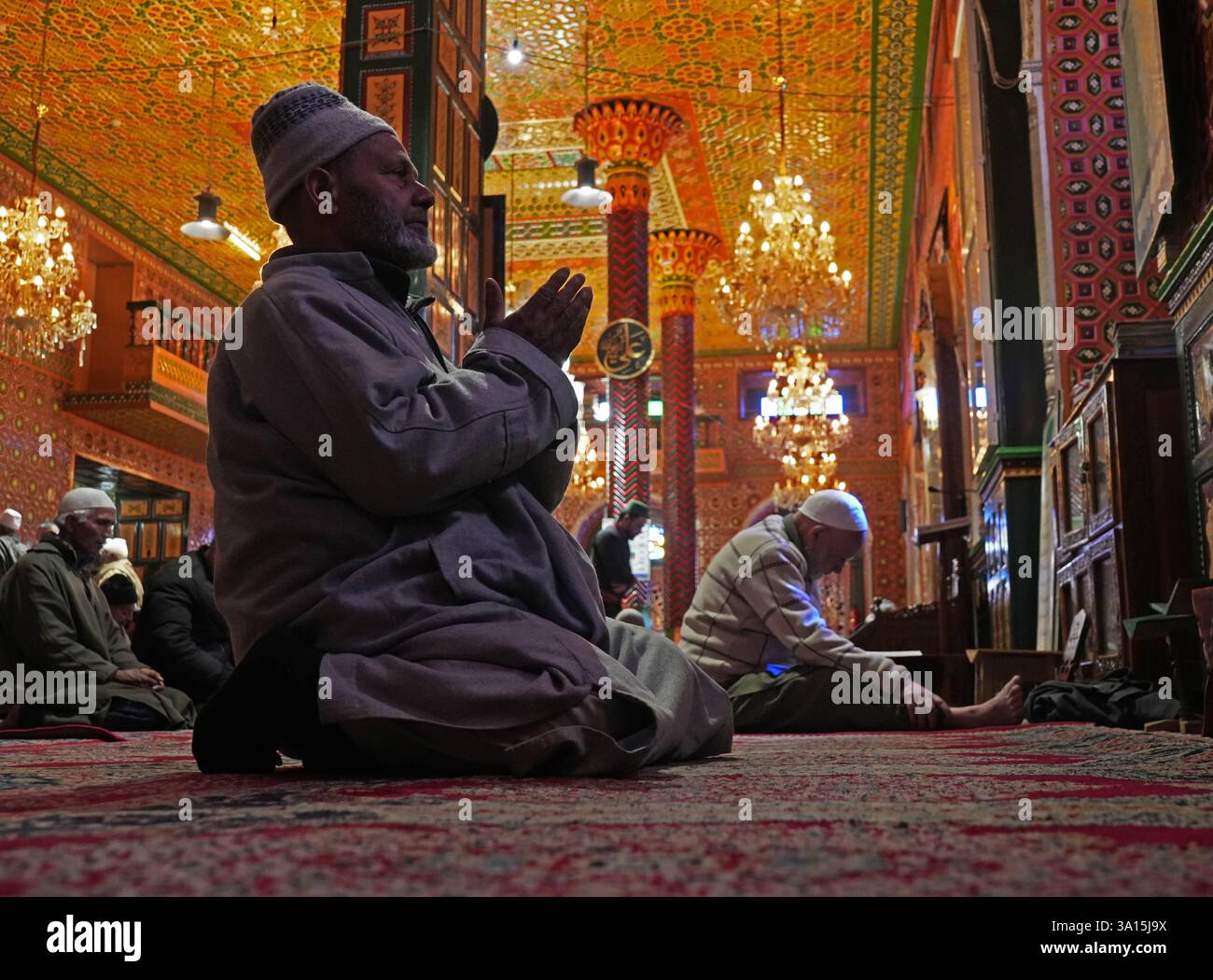 A Kashmiri Muslim praying inside the Dastgeer Sahib Shrine in Srinagar ...