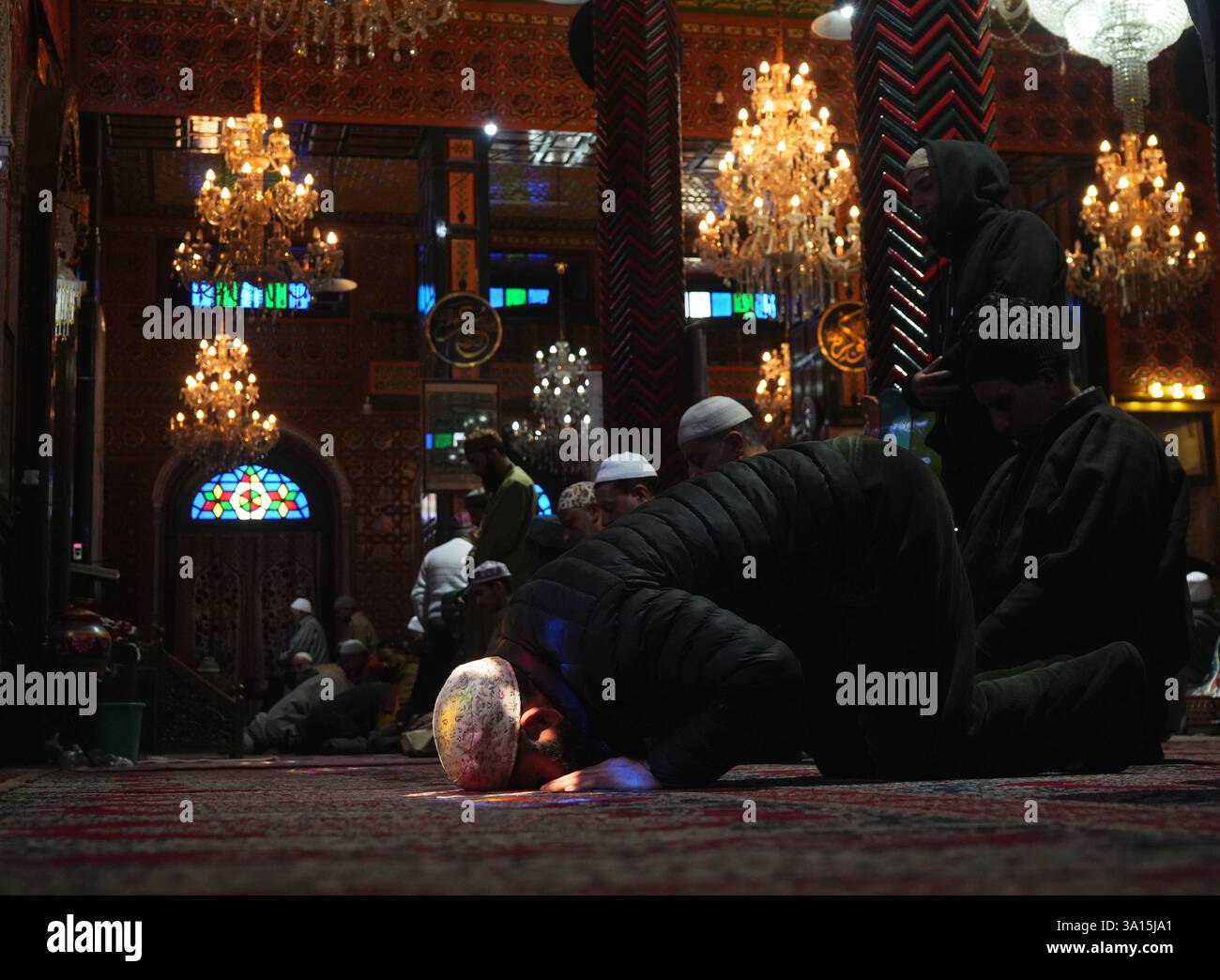 A Kashmiri Muslim praying inside the Dastgeer Sahib Shrine in Srinagar ...