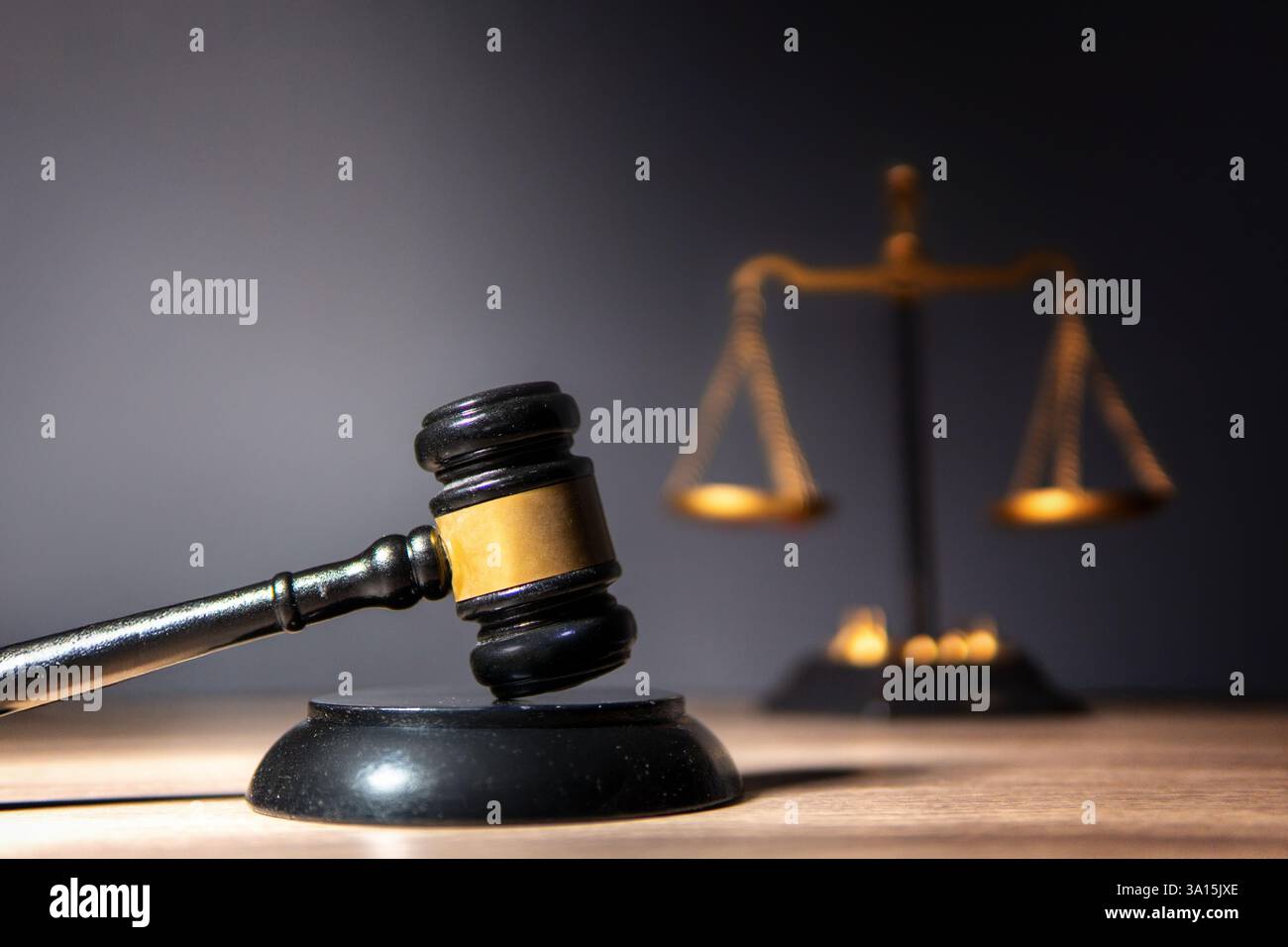 A scale of justice and a wooden gavel. Law, justice, and legal matters ...