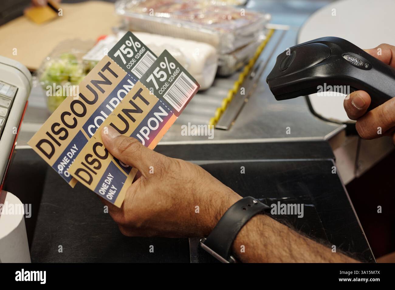 Cashier Scanning Discount Coupons for Groceries Stock Photo - Alamy