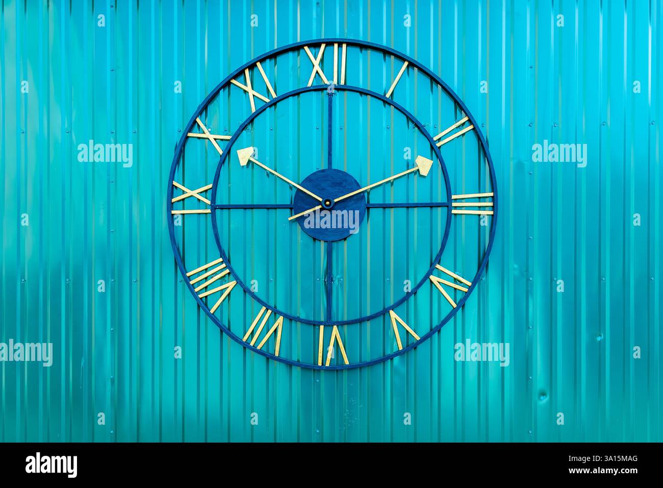 A decorative outdoor clock with Roman numerals and gold hands mounted ...