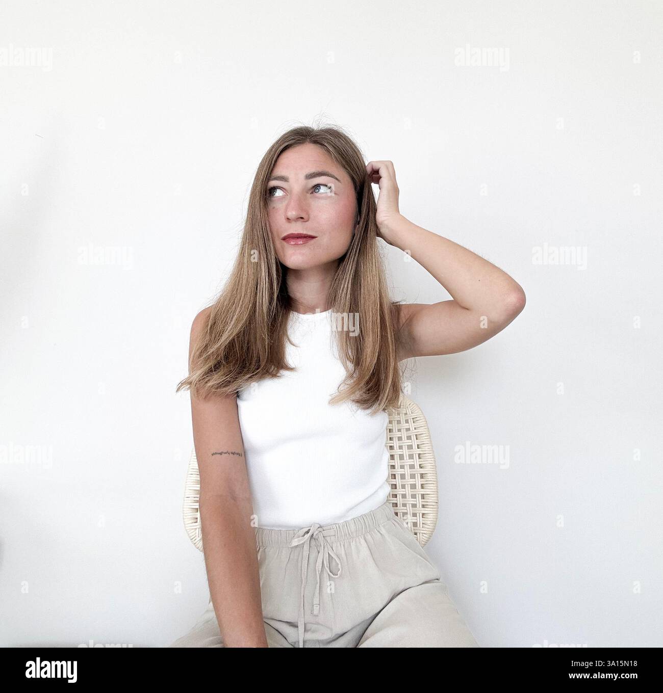 Woman in elegant white top hi-res stock photography and images - Alamy
