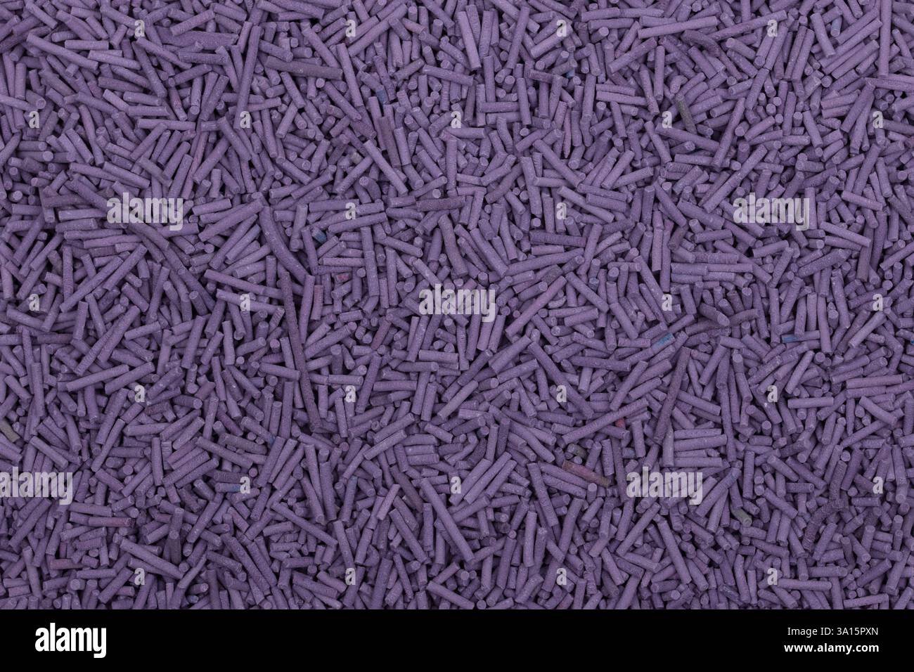 A high-resolution close-up of uncooked purple vermicelli pasta, showing ...