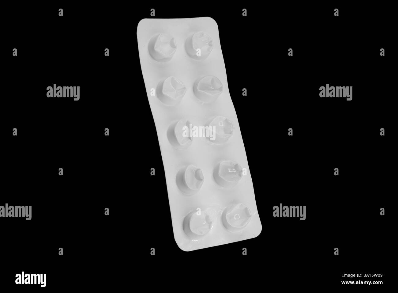 Empty pills of blister pack isolated on black background. Empty white ...