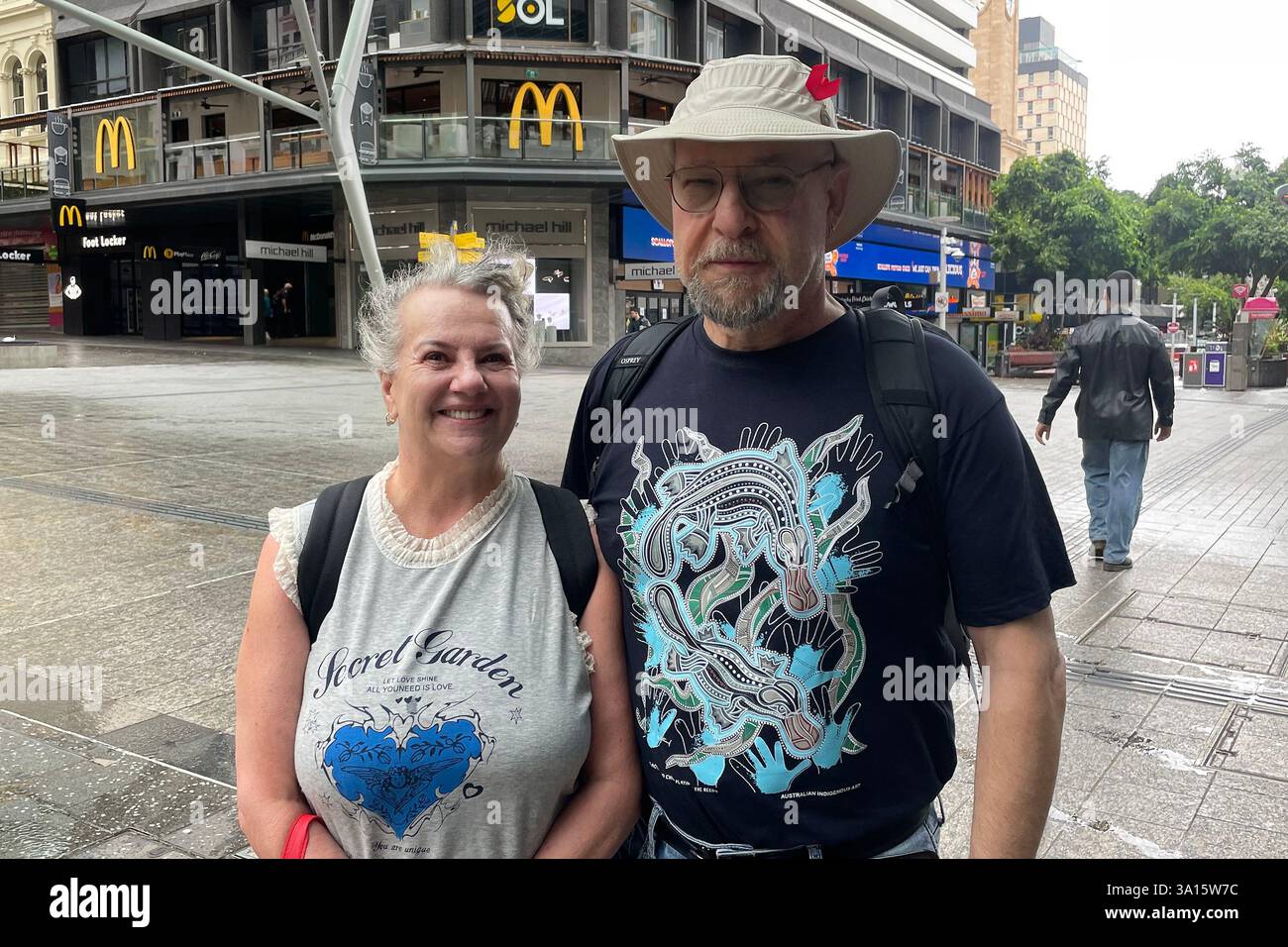 Canadian tourists Susan Coleman and Alex Evanochko pose for a ...