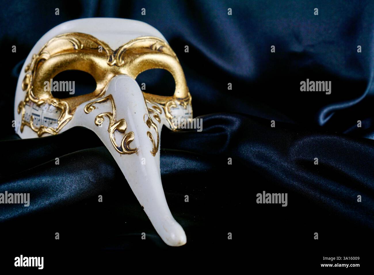 Venetian plague doctor mask on black fabric, masquerade and carnival ...