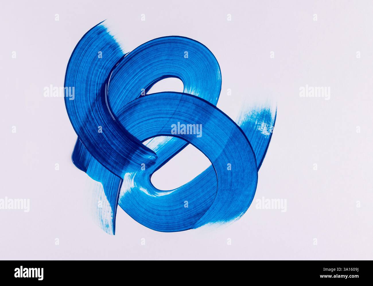 Beautiful curved lines of strokes in blue acrylic paint on a white ...