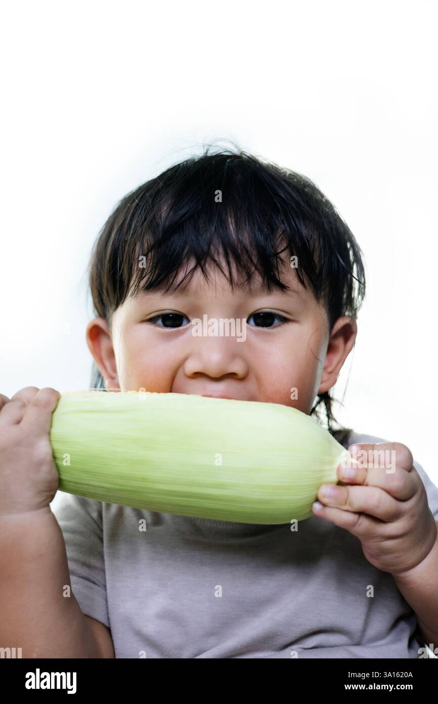 The Boy Bitting Fresh Corn, Background for advertising and wallpaper in ...