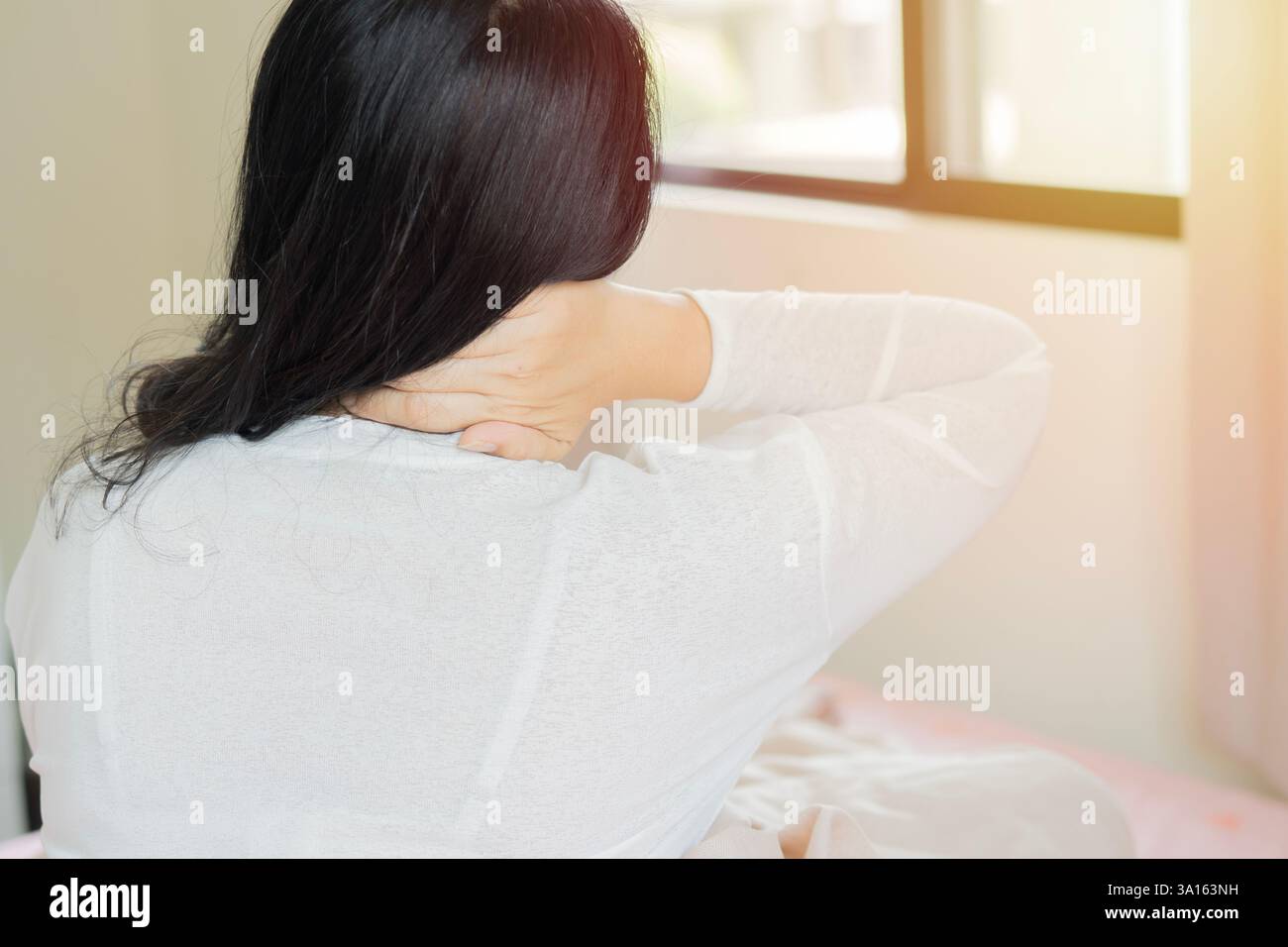 Back view head shot close up adult unhappy woman in bed, waking up in ...