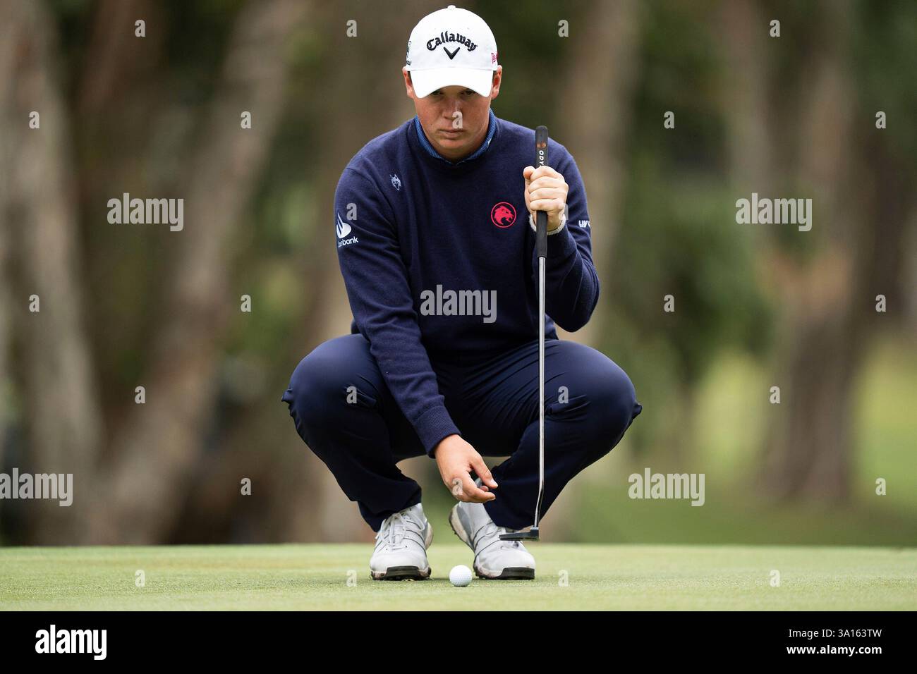 Caleb Surratt of Legion XIII reads his putt on the fourth green during ...