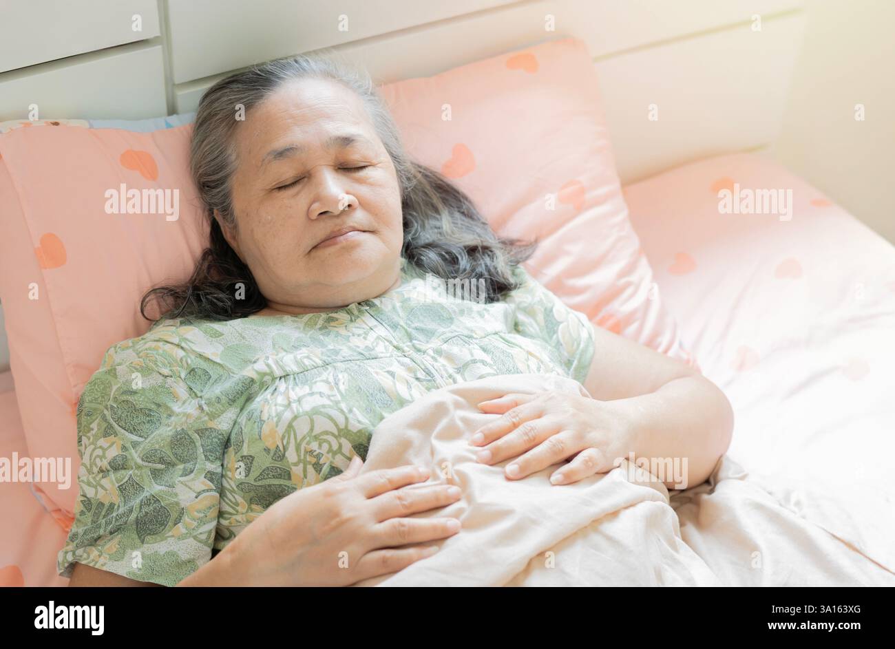Close up of calm senior woman lying on side sleeping peacefully in comfortable bed soft pillow ...