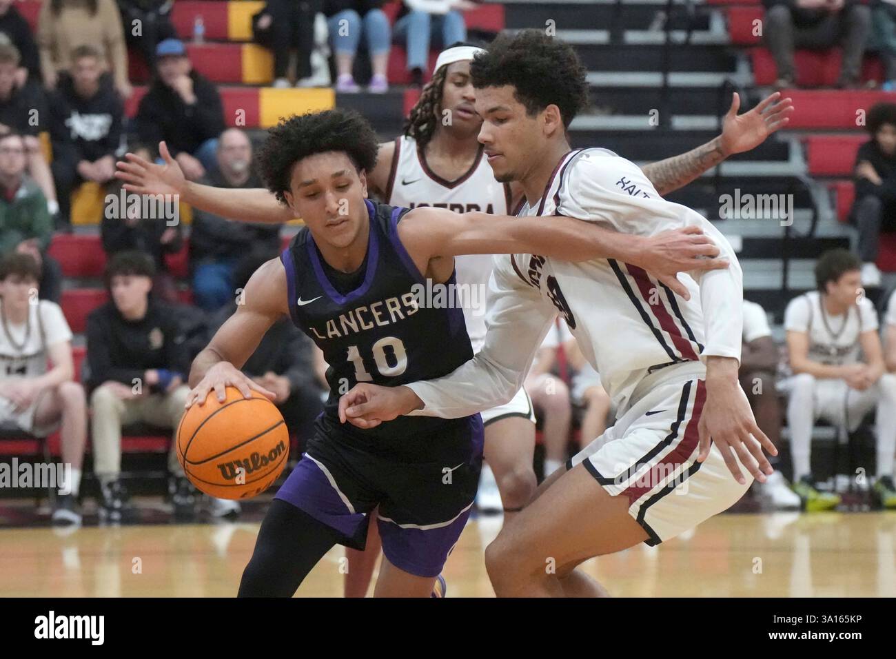 Jordan Garner of Carlsbad (10) dribbles the ball against Jarne Eyenga ...