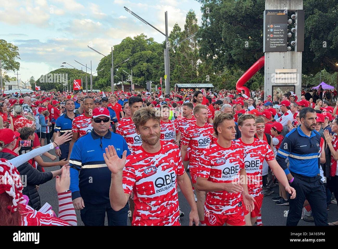 The Swans march from Swans HQ to the SCG in front of their supporters ...