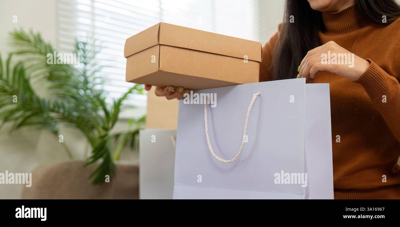Exciting unboxing moment woman hi-res stock photography and images - Alamy
