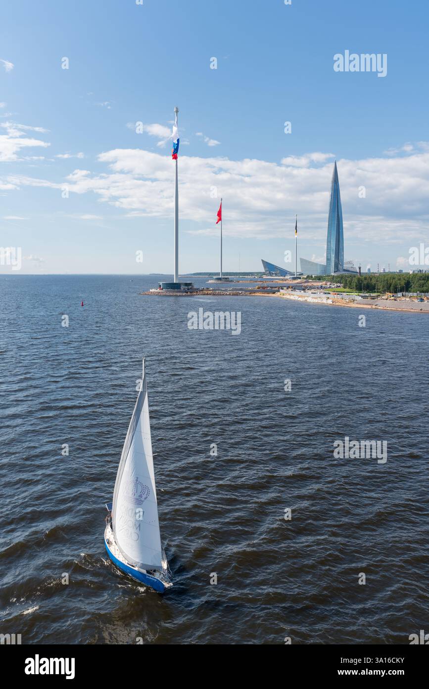 A yacht under sail with the Lakhta Center skyscraper in the background ...