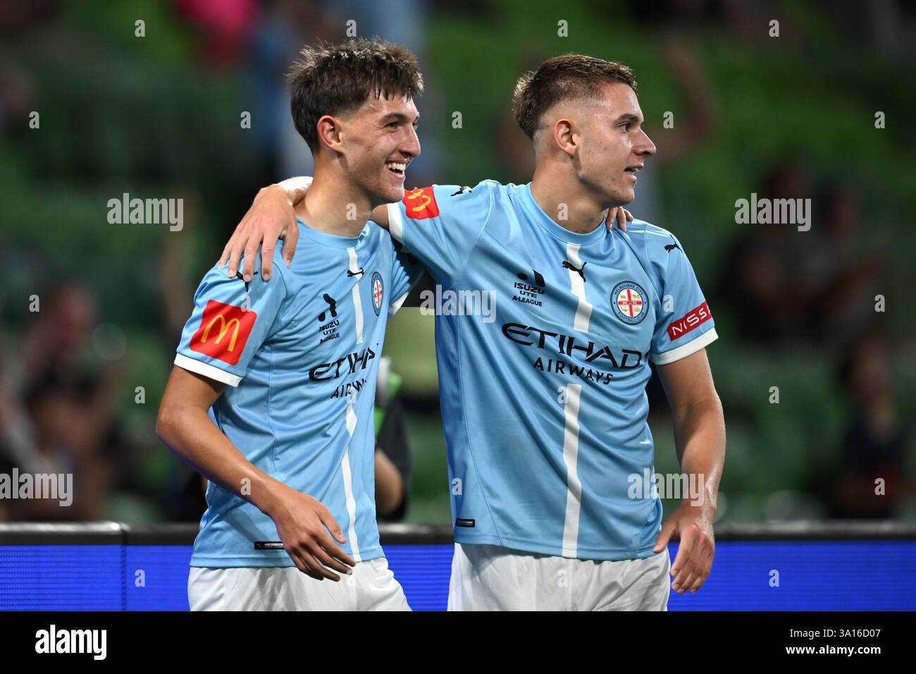 Max Caputo of Melbourne City (right) celebrates scoring a goal with ...