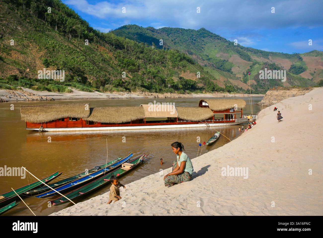 Laos, Mekong, Ban Baw, Lao Loun villagers on a sand dune overlooking ...