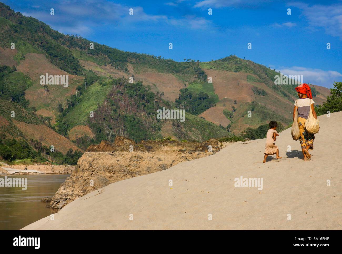 Laos, Mekong, Ban Baw, Lao Loun villagers on a sand dune overlooking ...