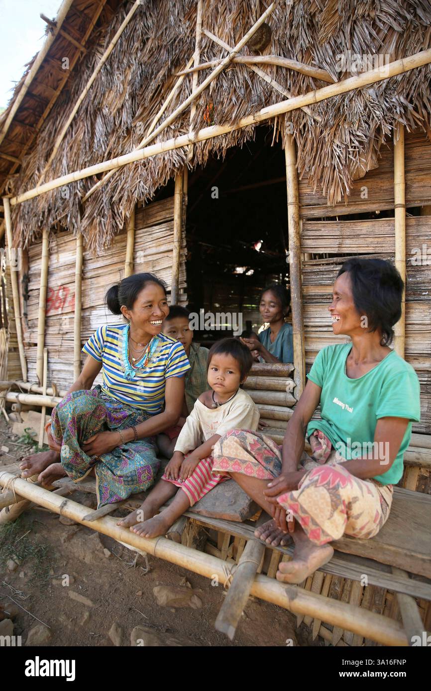 Laos, Mekong, Ban Baw, Lao Loum villagers in front of their bamboo ...