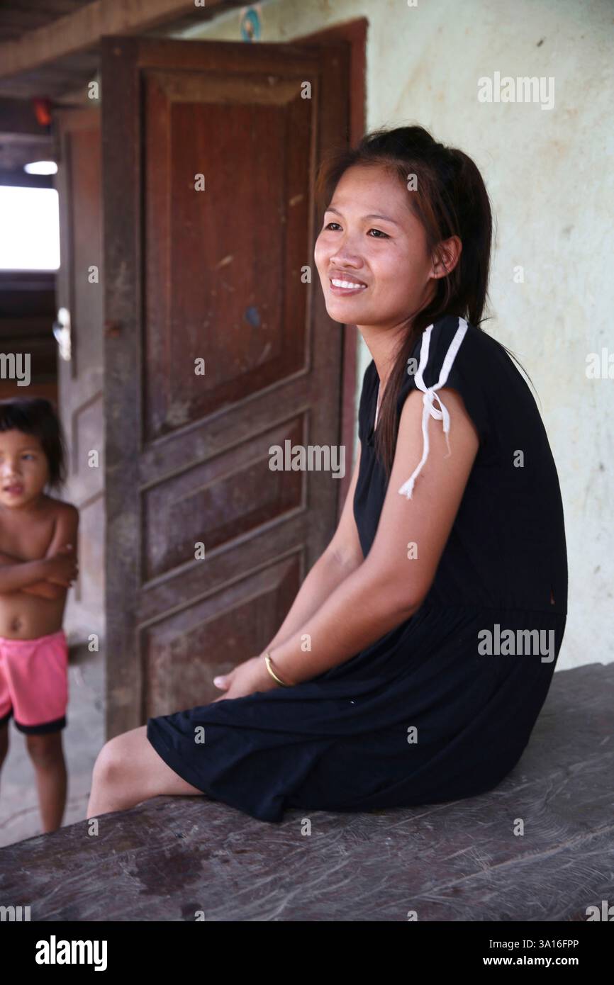 Laos, Mekong, Lao Loum woman in a traditional village on the banks of ...