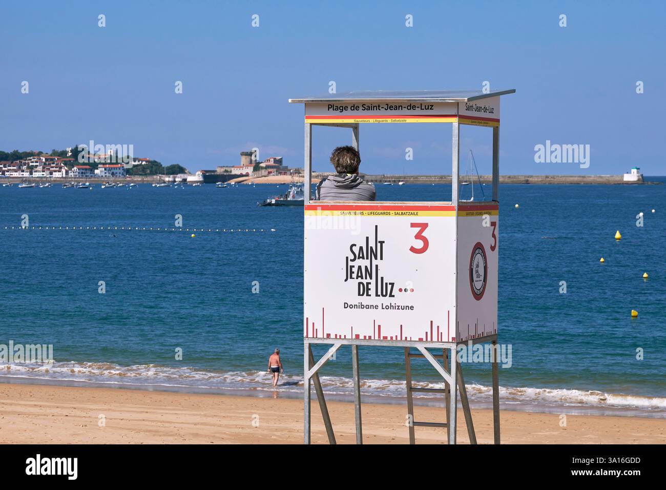 Man sitting in lifeguard chair hi-res stock photography and images - Alamy