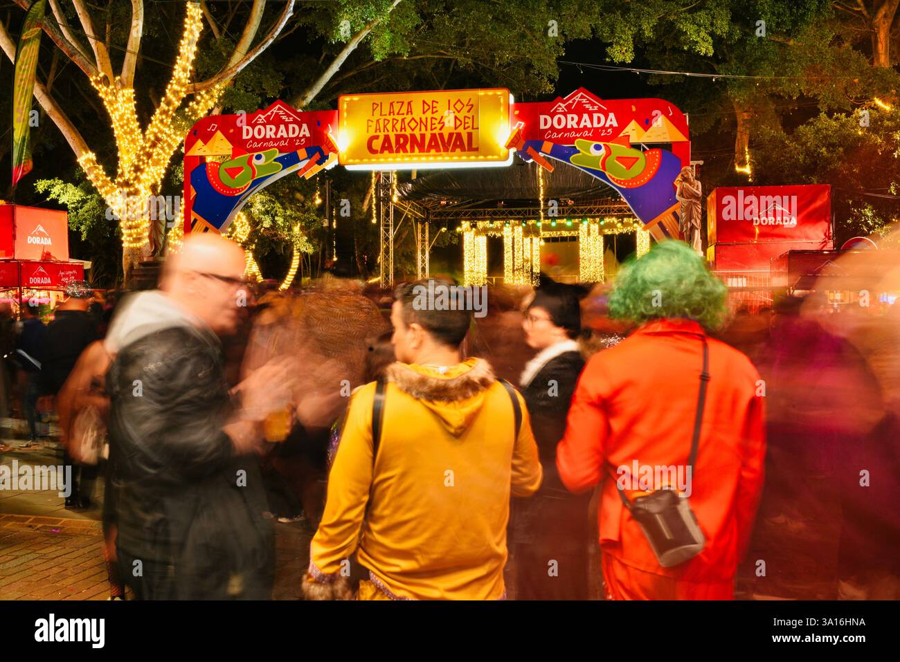 Live music performance stage with crowds of costumed attendees drinking ...