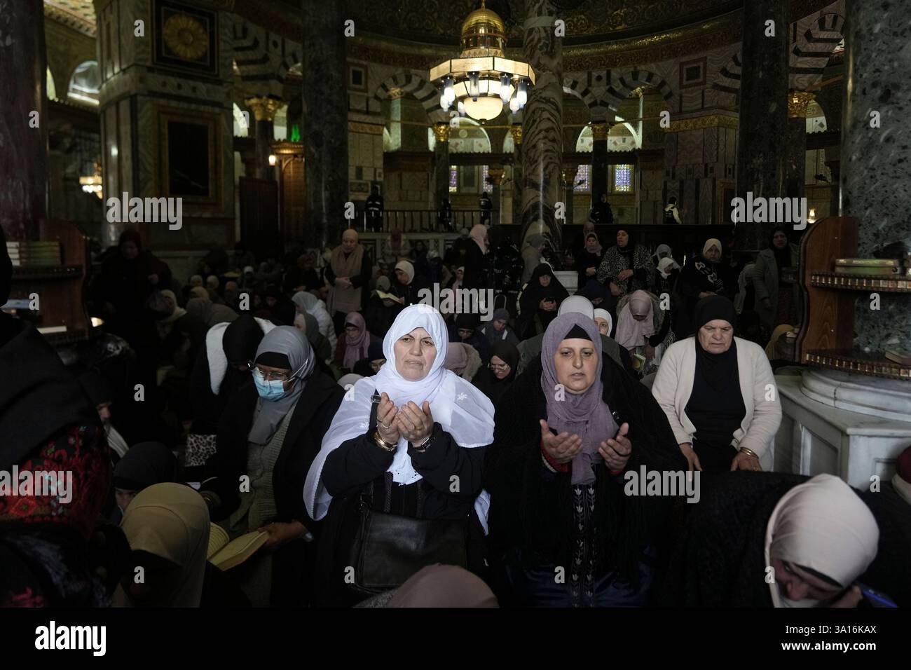 Women pray at the Al-Aqsa Mosque compound during the first Friday ...