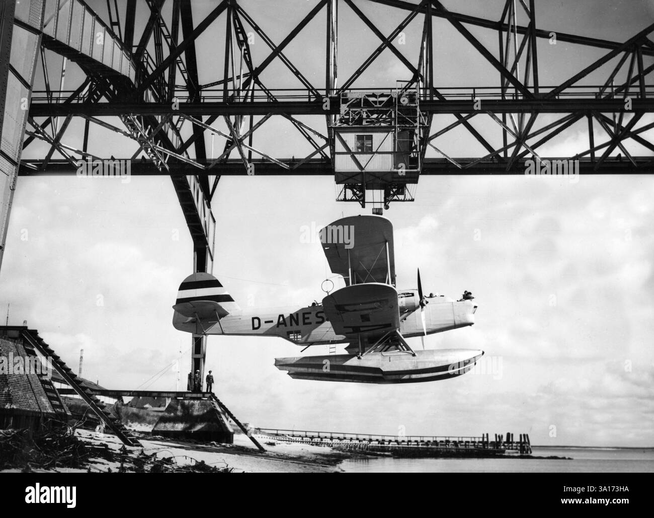 Heinkel He 59 seaplane at a naval air base. The aircraft is lifted from ...