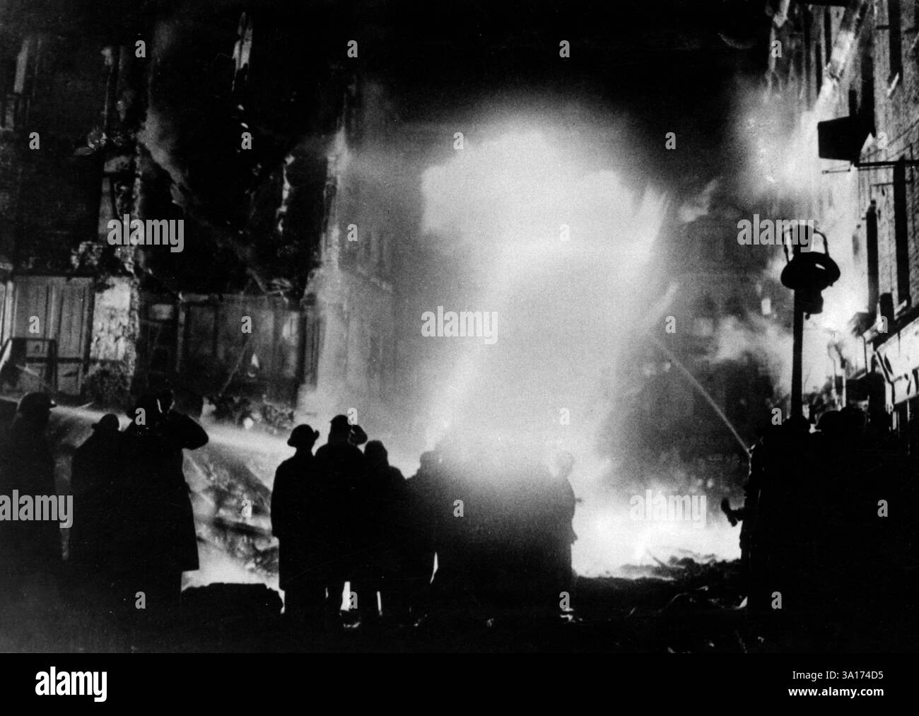 Gas pipe burst in a London street as a result of a bomb hit. [automated ...