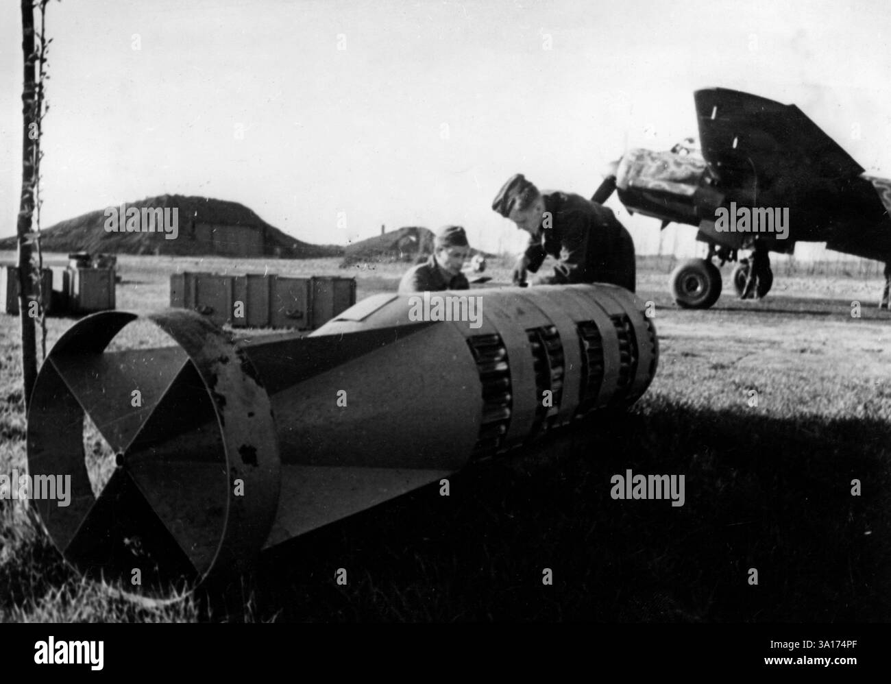 Luftwaffe soldiers with an aerial bomb at an airfield on the Eastern ...