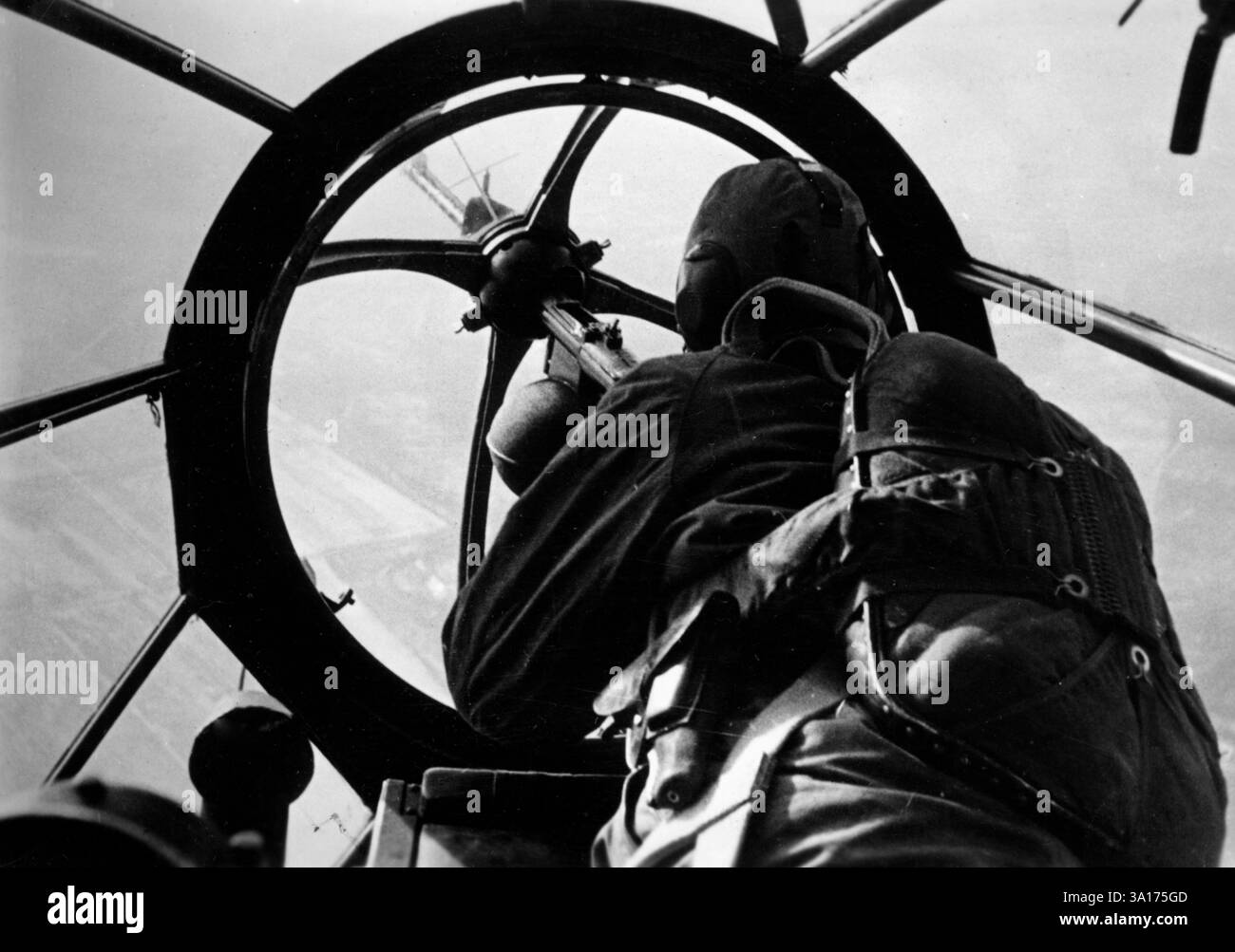 The gunner in the nose of a Heinkel He 111 on a mission over the ...