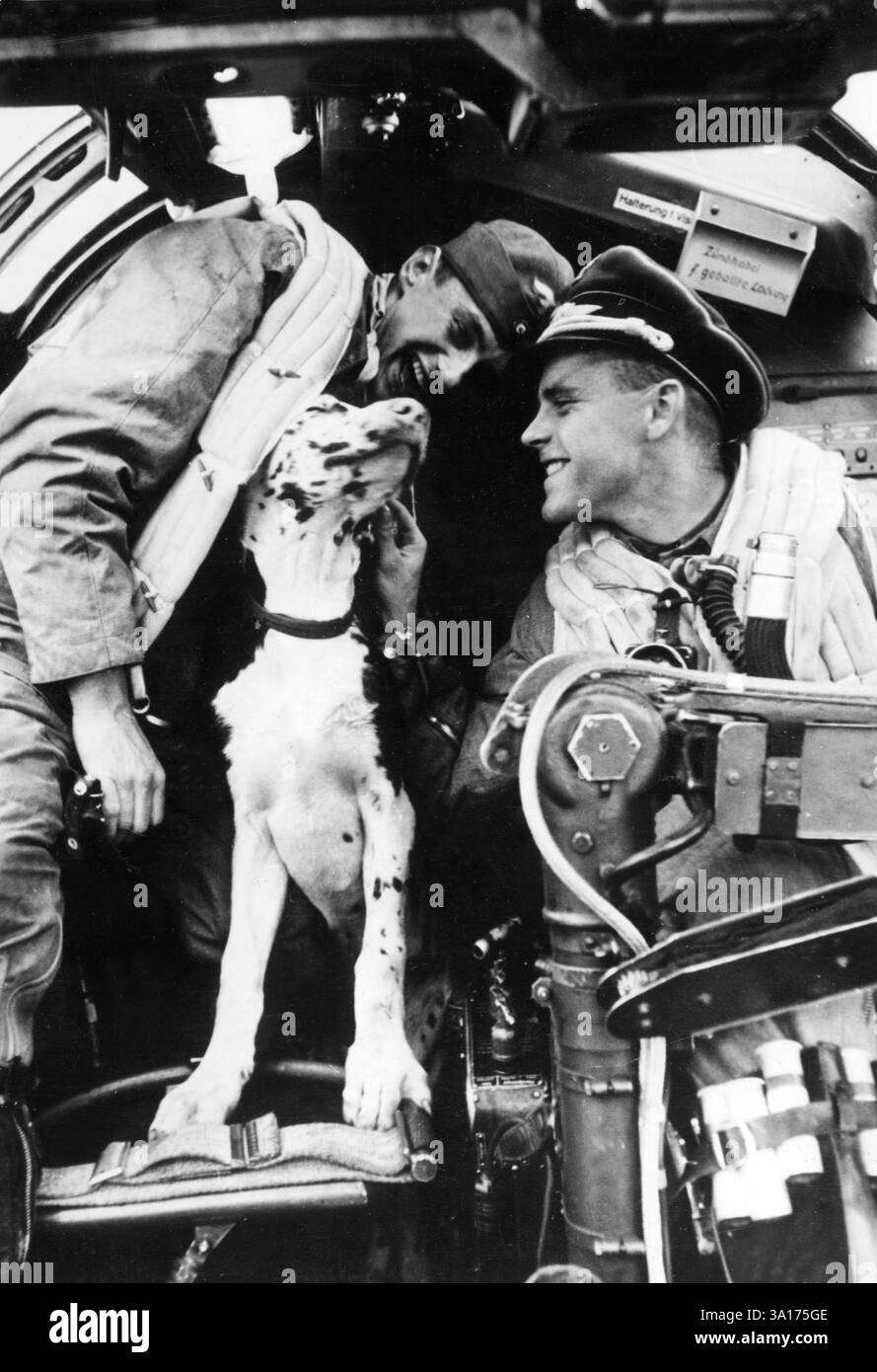 "The crew of a German fighter plane, presumably a Heinke He 111, poses ...