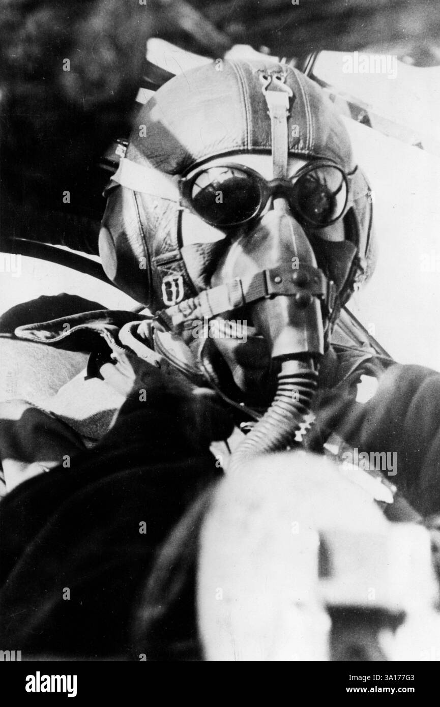 Observer in a Junkers Ju 88 fighter plane, wearing an oxygen mask and ...