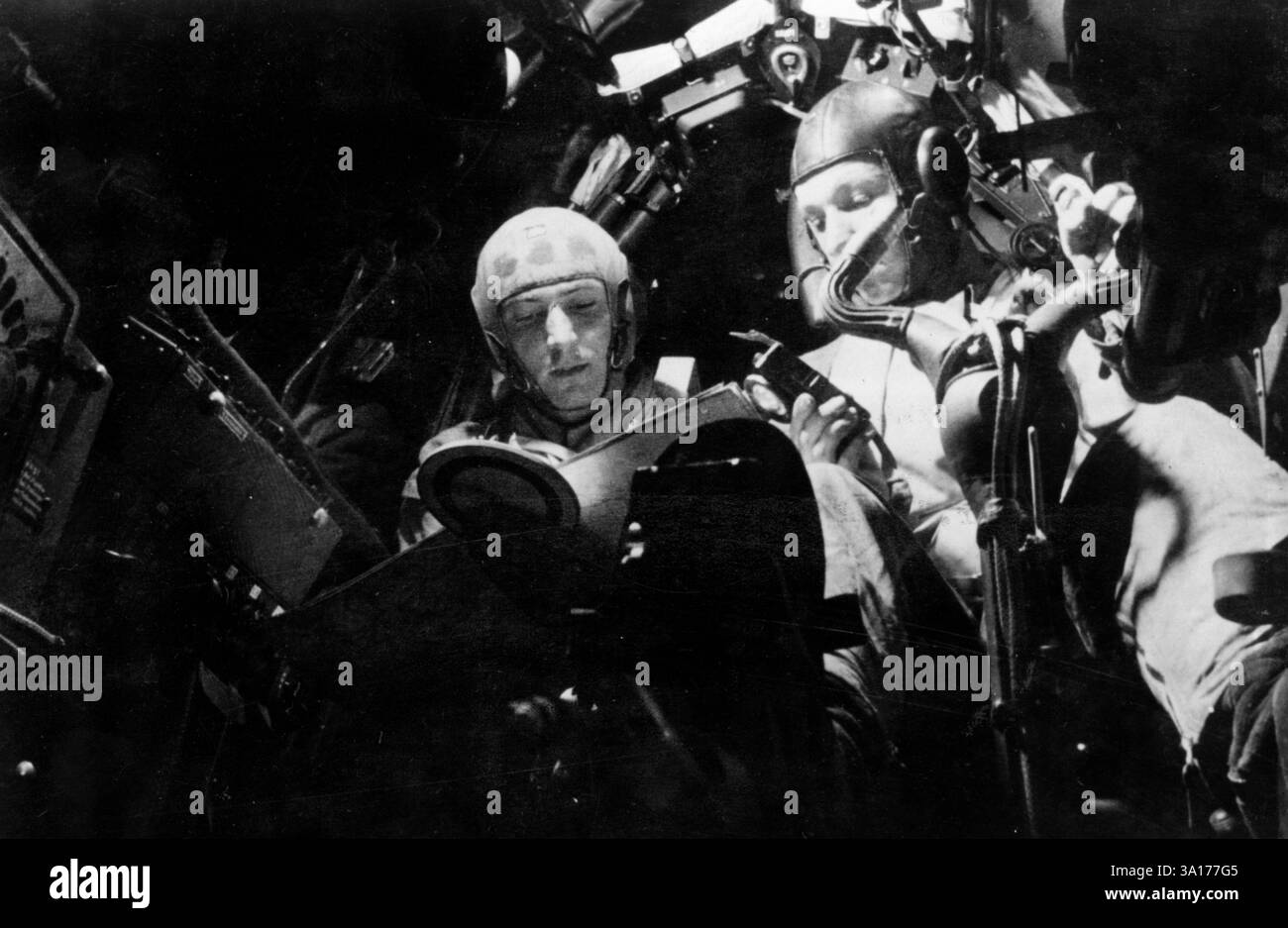 View into the cockpit of a German fighter plane during a night raid on ...