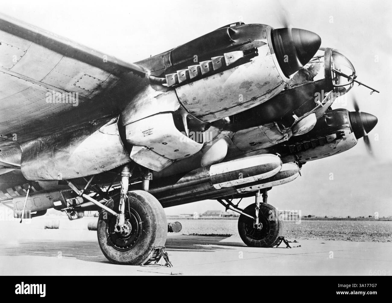 A German Luftwaffe fighter plane with torpedoes underneath before take ...