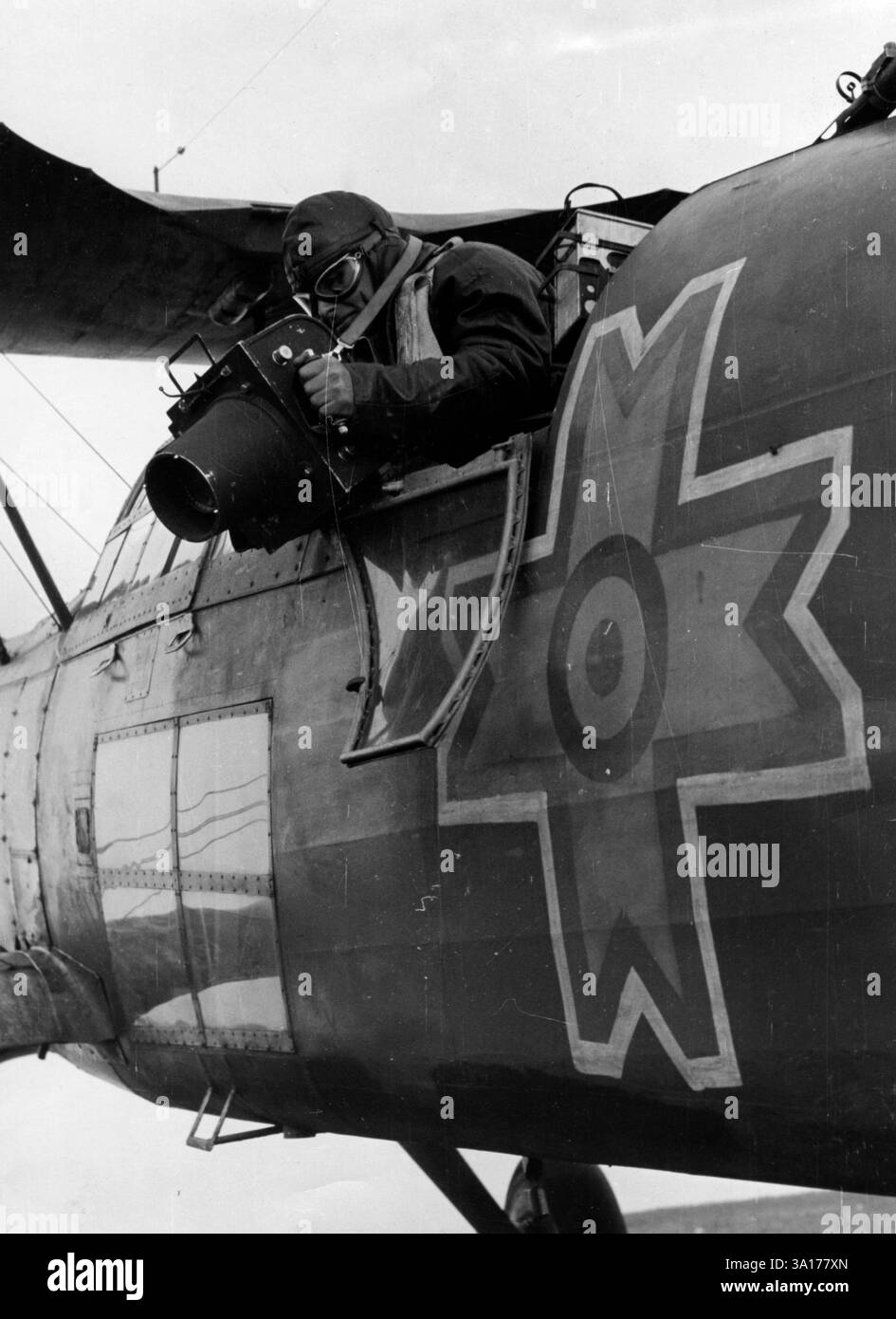 The observer of a Romanian reconnaissance aircraft poses with his plate ...