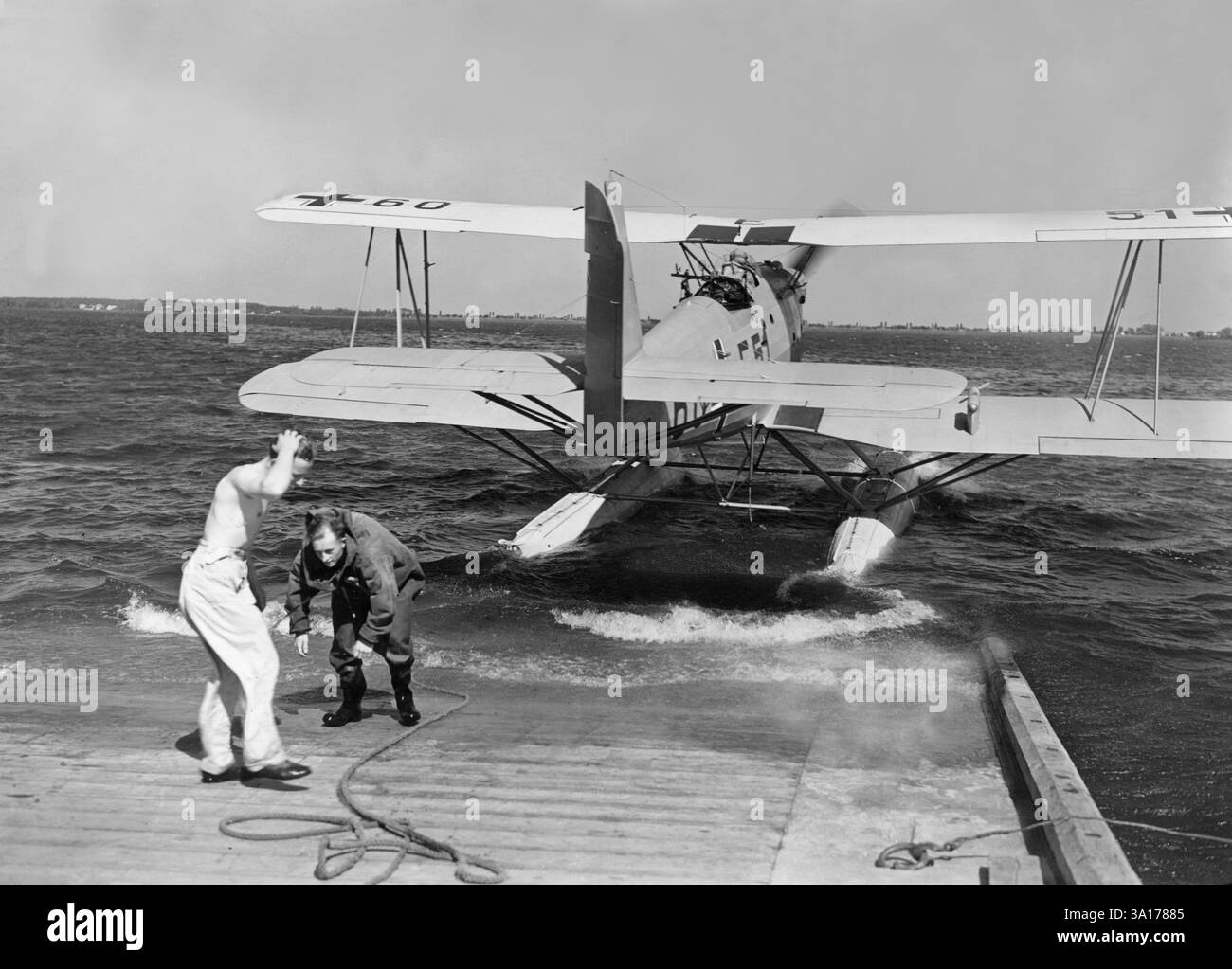 Heinkel He 60 seaplane taking off from a naval air base. [automated ...