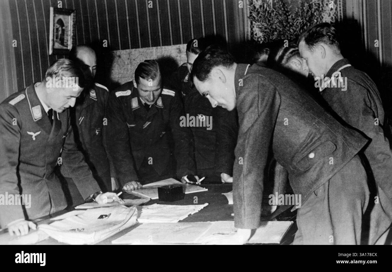 Aircraft commander and observer discuss the mission with the squadron ...