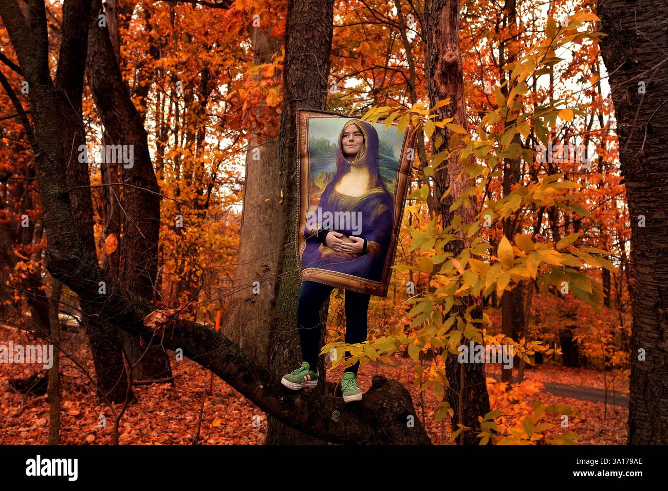Hilarious teenager in Mona Lisa costume standing in colorful forest ...
