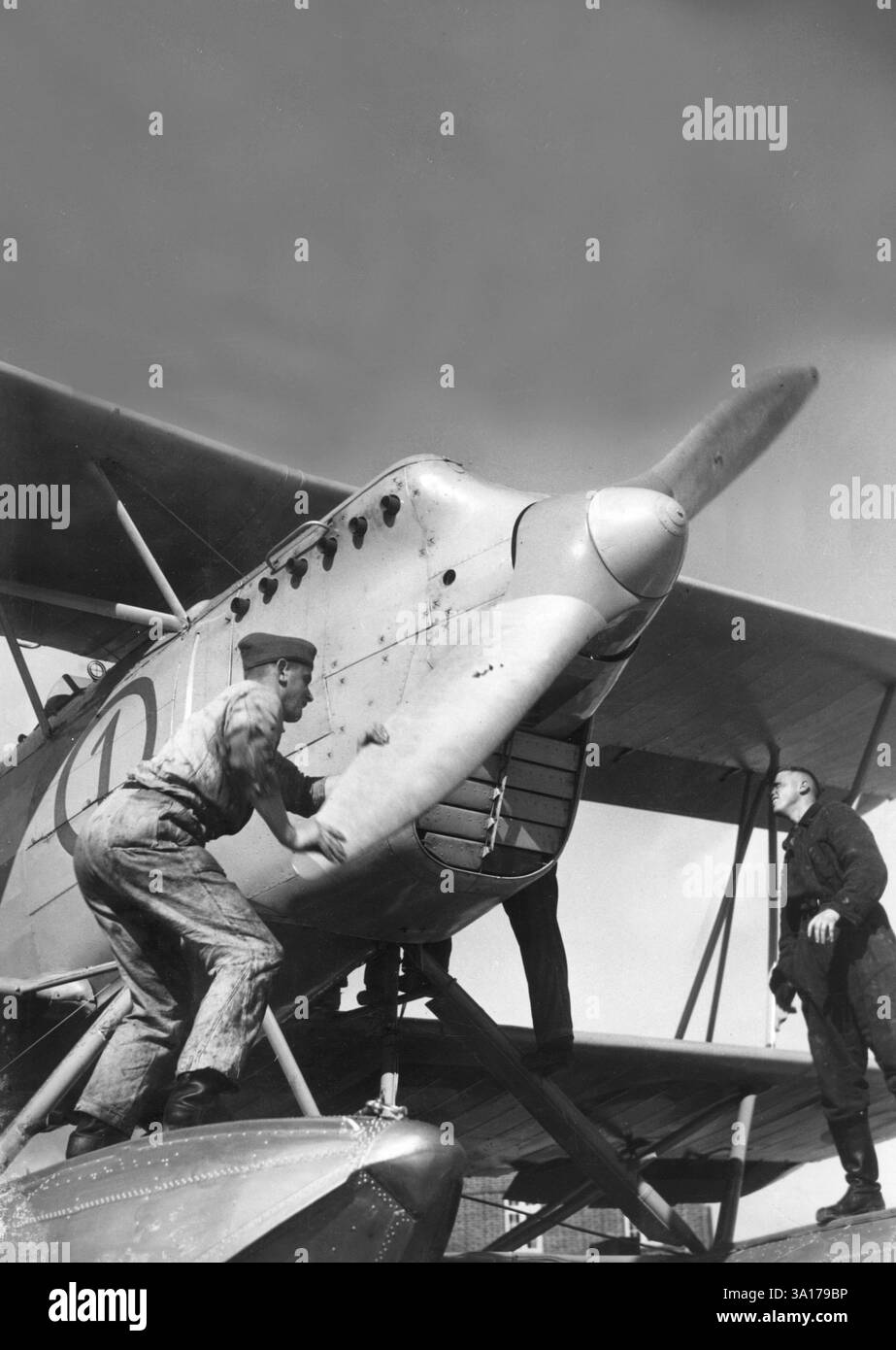 Launch preparations for a Heinkel He 60 at a naval air base. The Wart ...