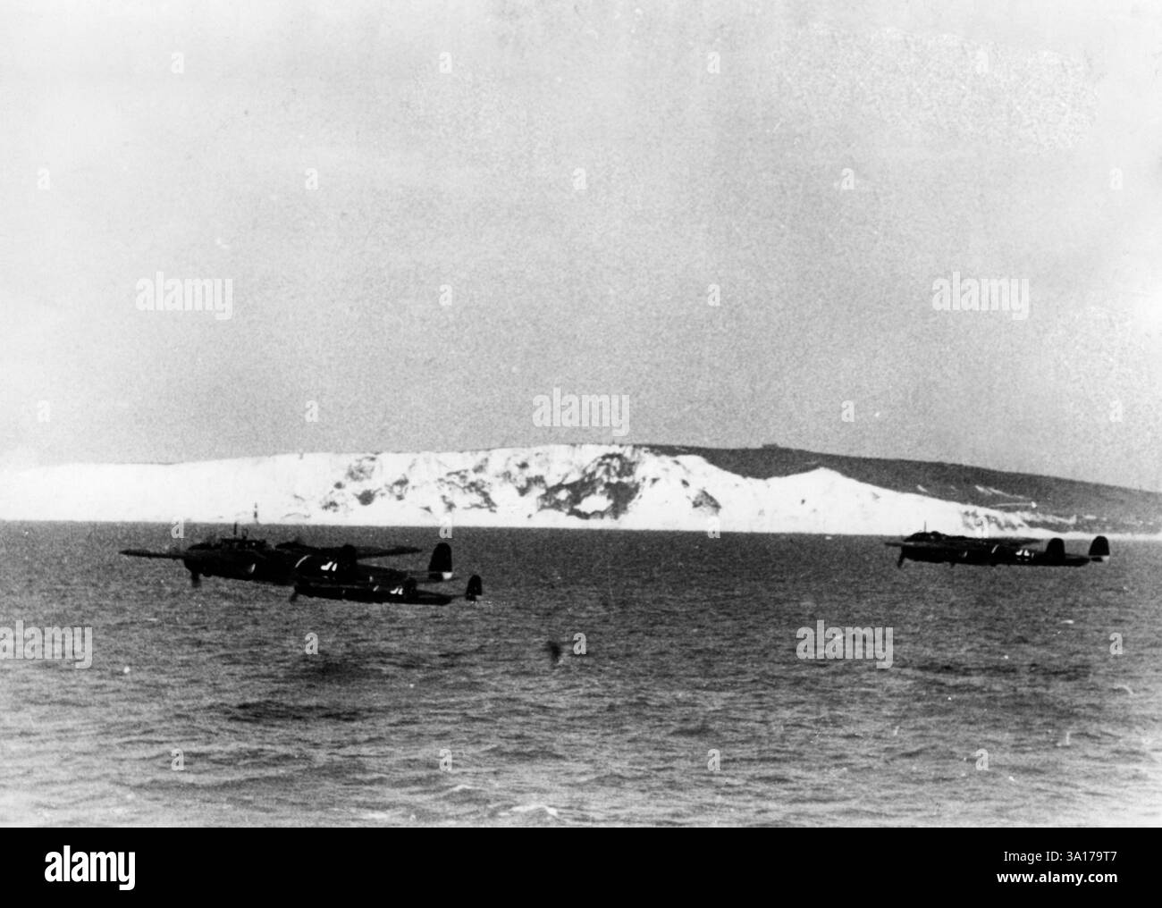 German fighter planes flying low over the English Channel against the ...