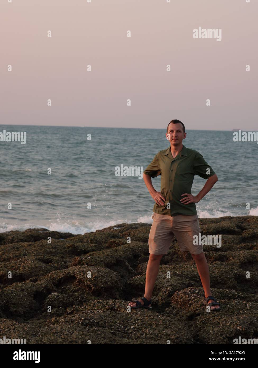 Man on beach during sunset hi-res stock photography and images - Alamy