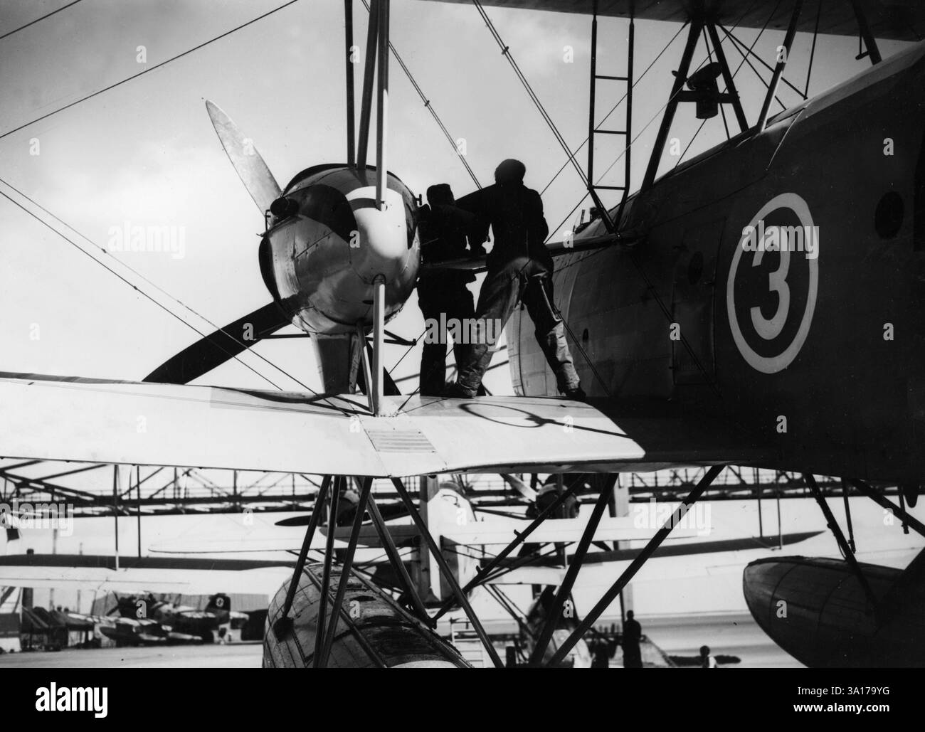 Heinkel He 59 seaplane at a naval air base. Starting the engine. The ...