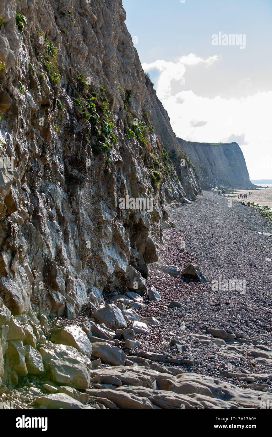A breathtaking sight of rugged coastal cliffs beside a rocky beach ...