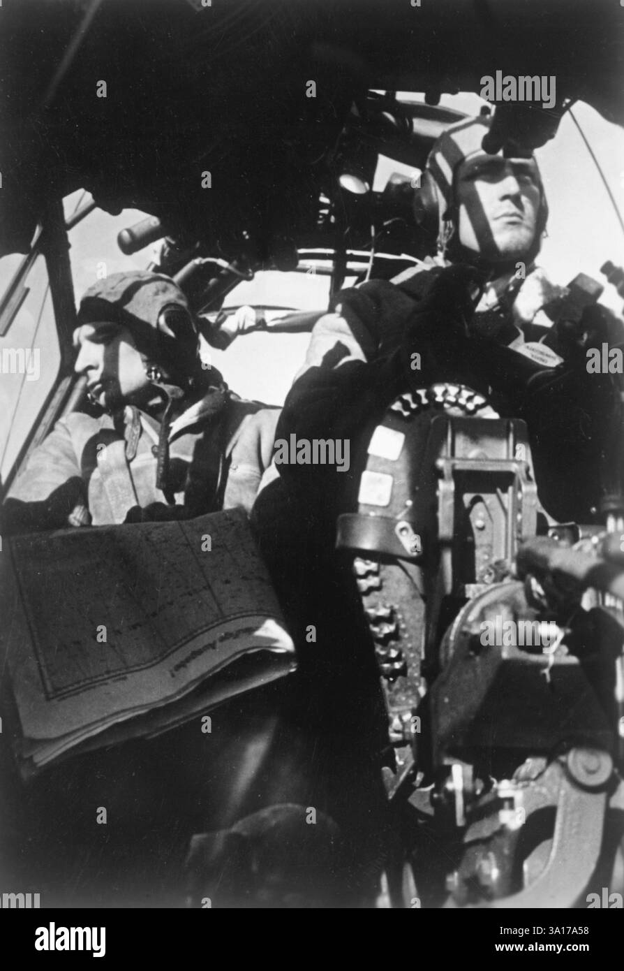 Pilot in a Junkers Ju 88 on a mission on the Eastern Front. He wears ...