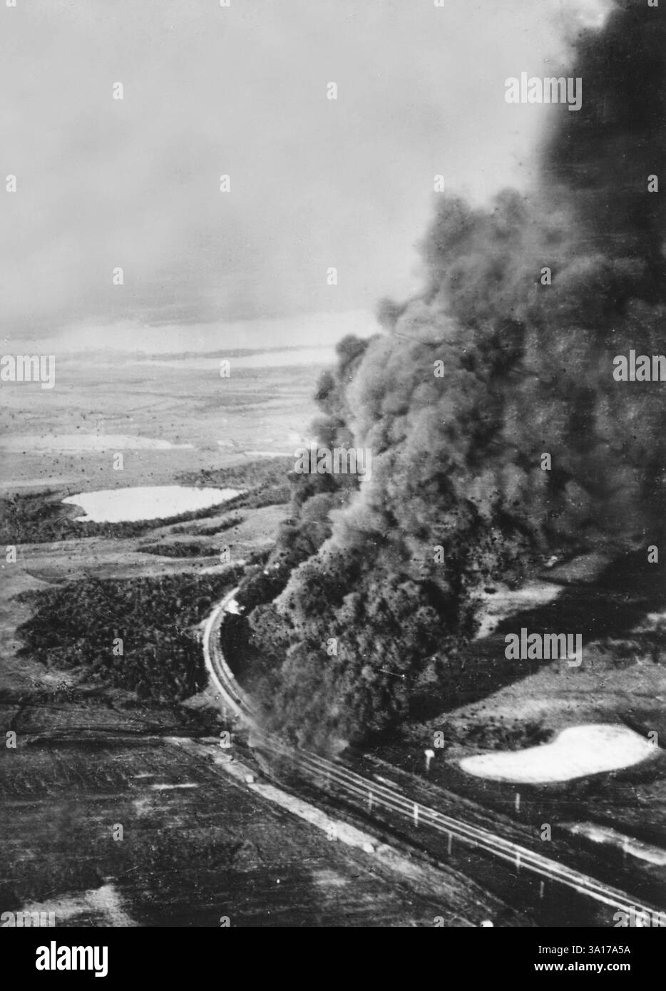 Aerial view of a burning train on a railroad line on the eastern front ...