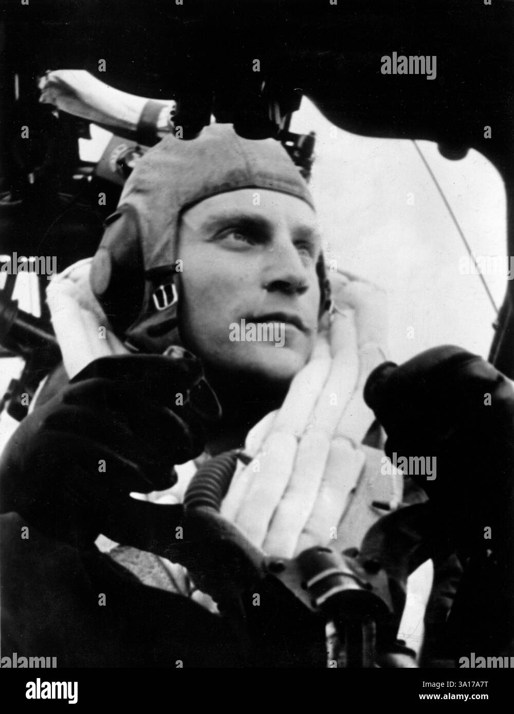 Pilot in the cockpit of a fighter plane during a mission over England ...