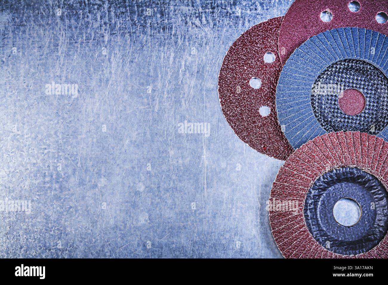 Grinding discs abrasive flap wheels on scratched metallic background ...
