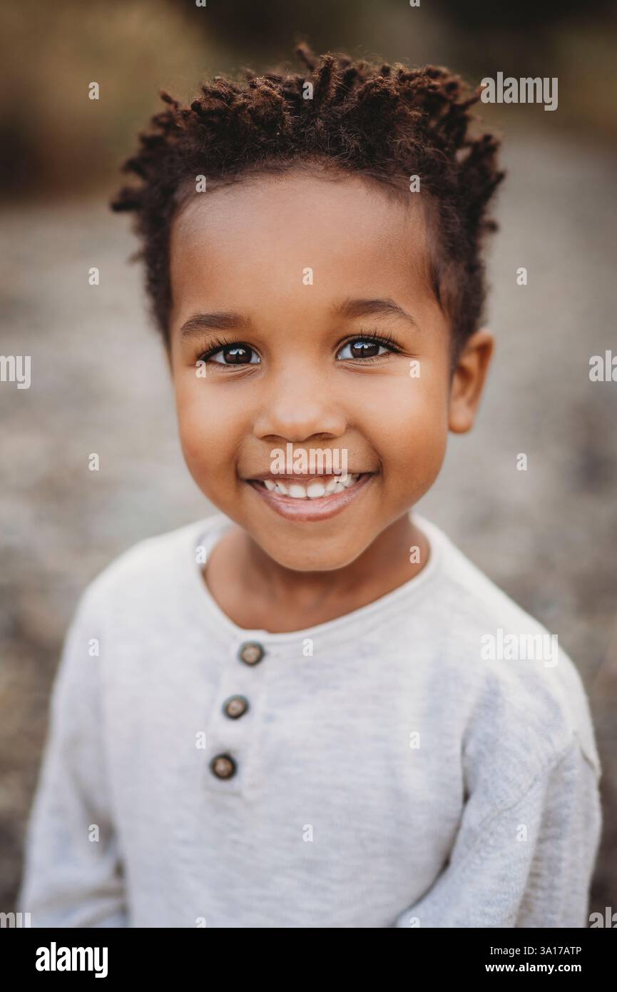 Portrait beautiful black 5 year old boy smiling outside in sumer Stock ...