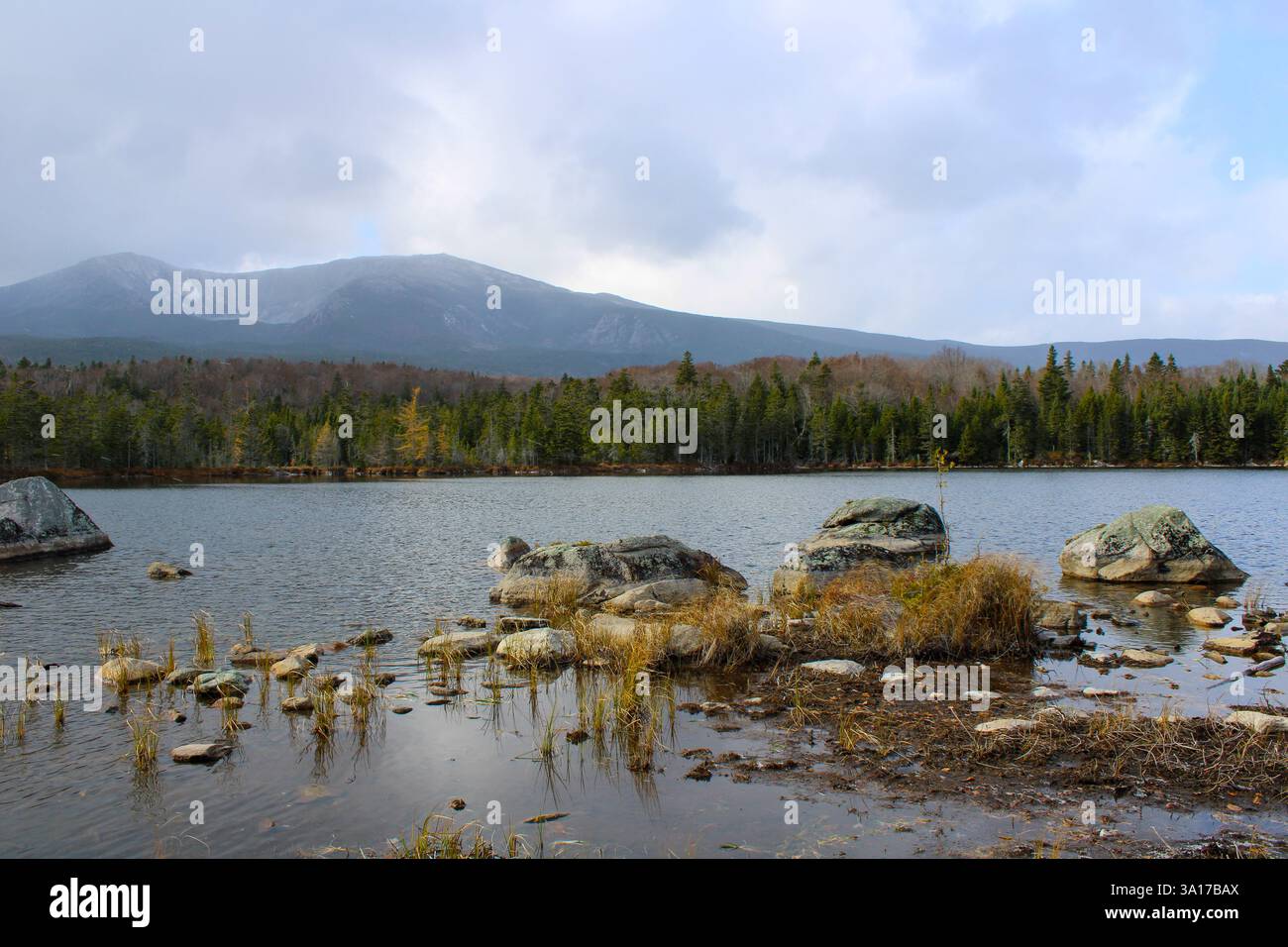 Granite rocks sitting in the shallow waters of Sandy Stream Pond Stock ...